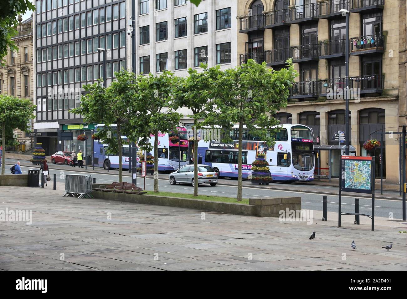 LEEDS, UK - JULY 11, 2016: Double decker buses at a bus stop at Headrow ...