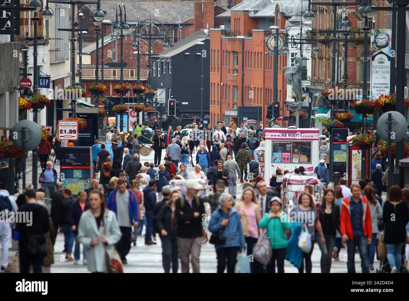 LEEDS, UK - JULY 11, 2016: People shop at Briggate street in downtown ...