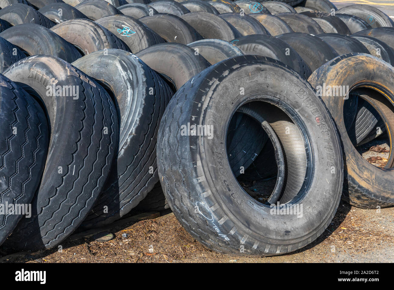 Used and worn lorry tyres stored at a garage, Scotland, UK Stock Photo ...