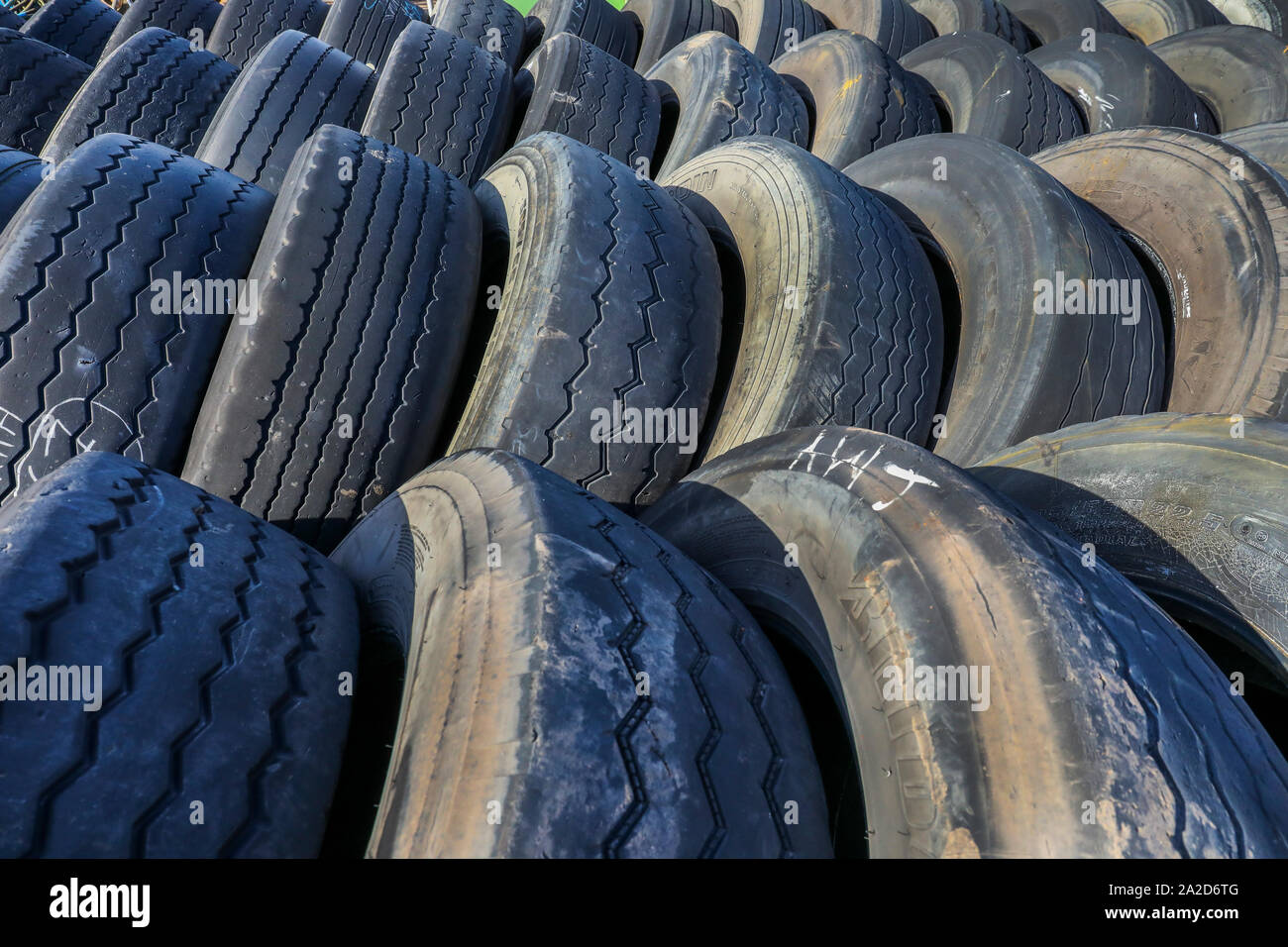 Used and worn lorry tyres stored at a garage, Scotland, UK Stock Photo ...