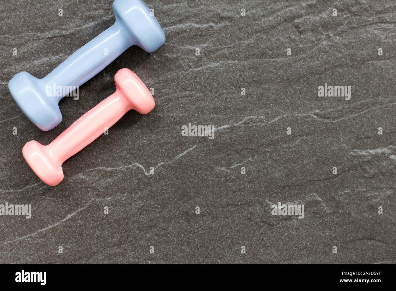 Still life of fitness workout scene with coloured weights Stock Photo ...