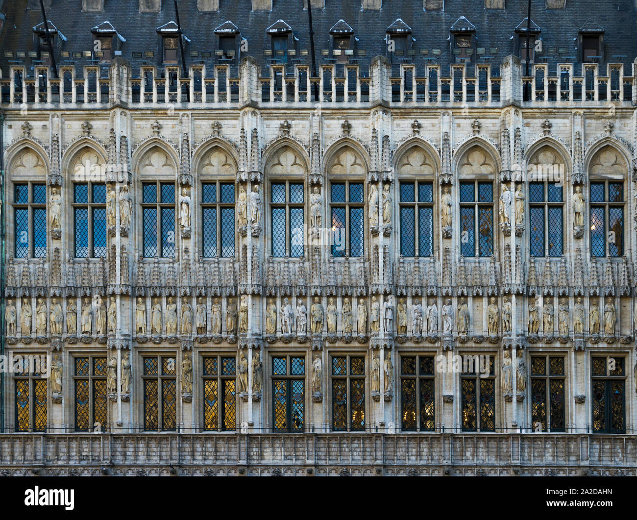 Facade of a building with a repeated structure of windows and gothic ...