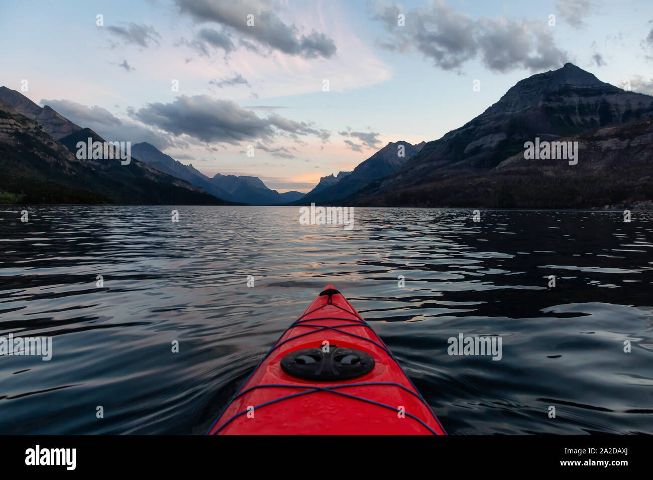 Kayaking in Glacier Lake surrounded by the beautiful Canadian Rocky ...