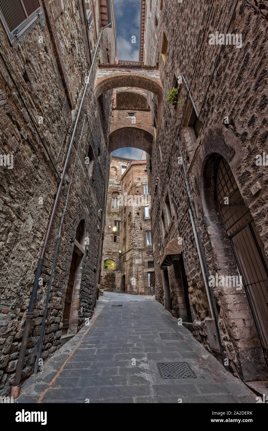 Ancient monumental architecture in Perugia. Narrow streets, arches and ...
