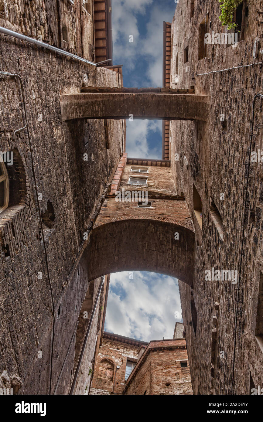 Ancient monumental architecture in Perugia. Arches and old buildings in ...