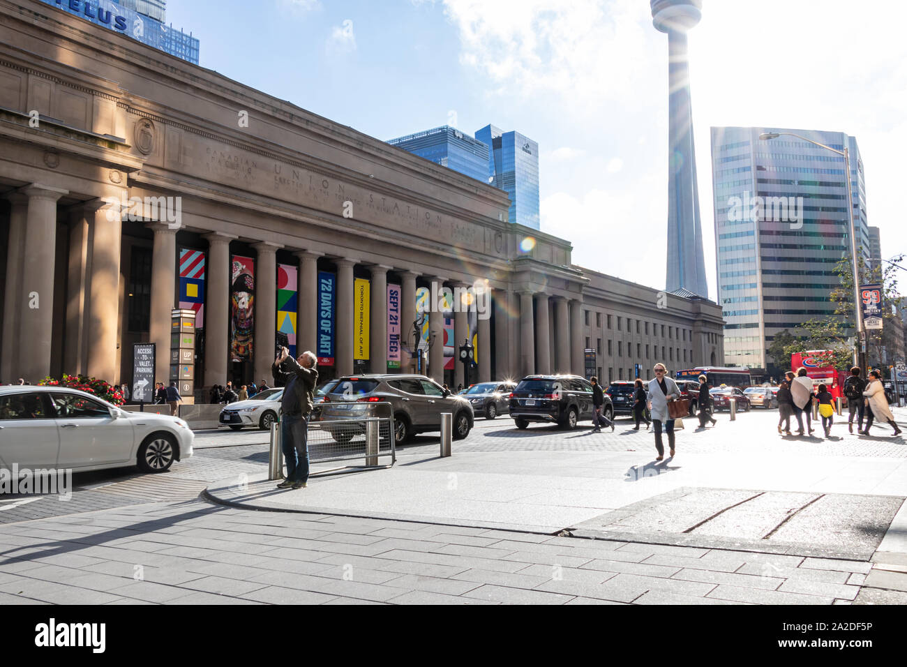 Toronto Union Station during afternoon rush hour as the sun glares down ...