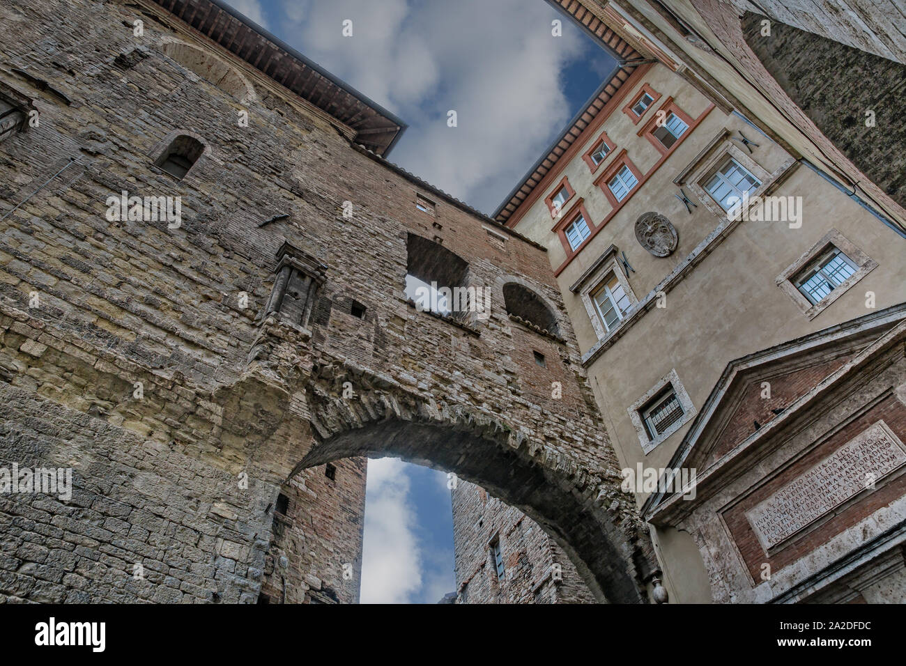 Ancient monumental architecture in Perugia. Arches and old buildings in ...