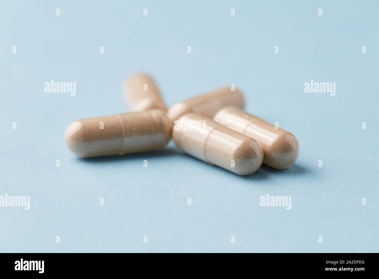 Ashwagandha (Withania somnifera) capsules. Bright paper background ...