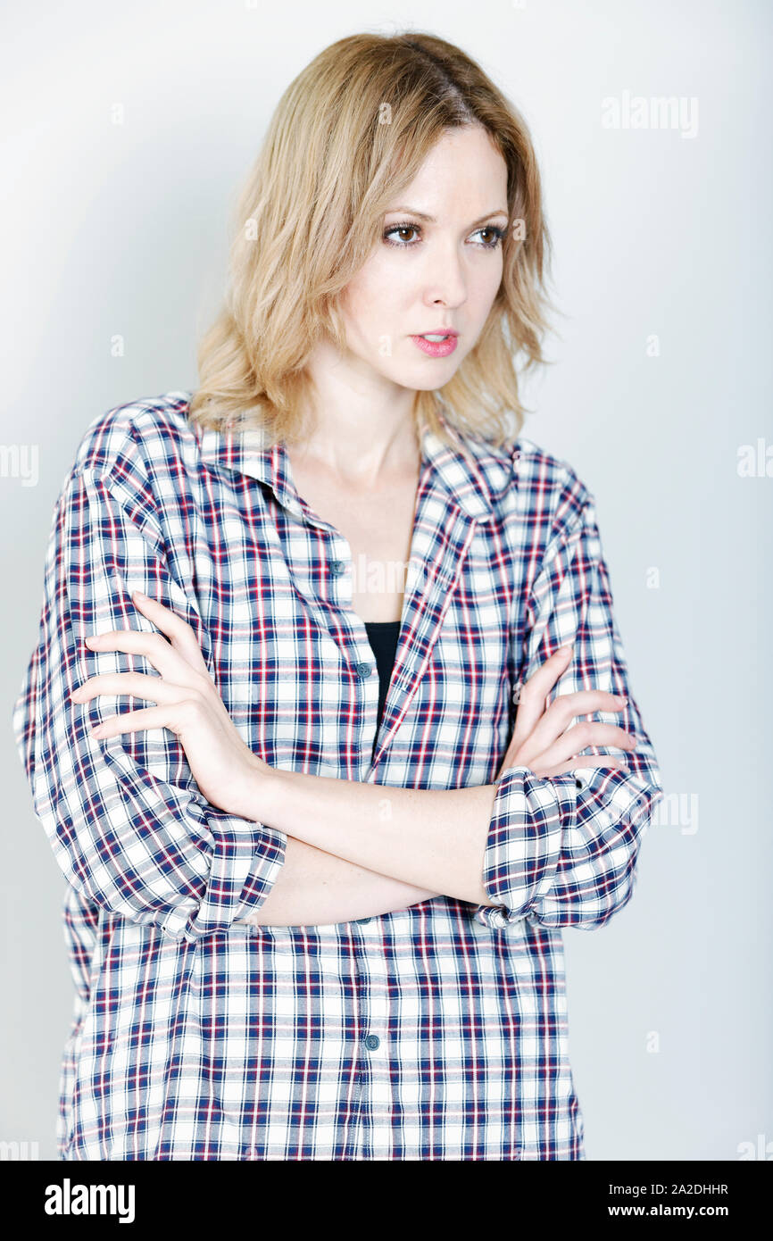 Beautiful young woman looking concerned and upset Stock Photo - Alamy