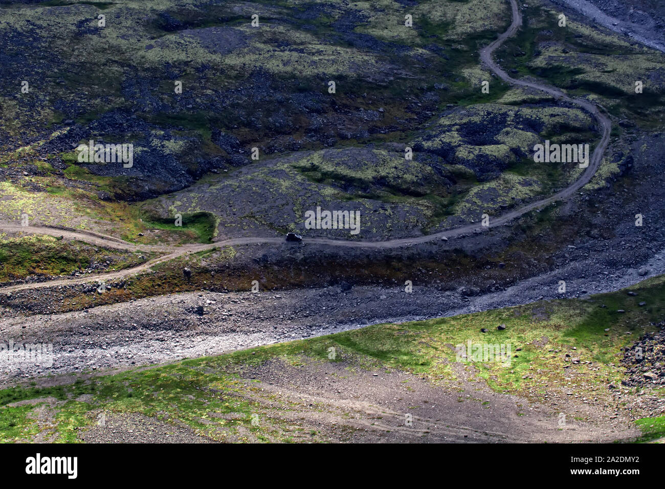 Road on the bottom of a mountain gorge Stock Photo - Alamy