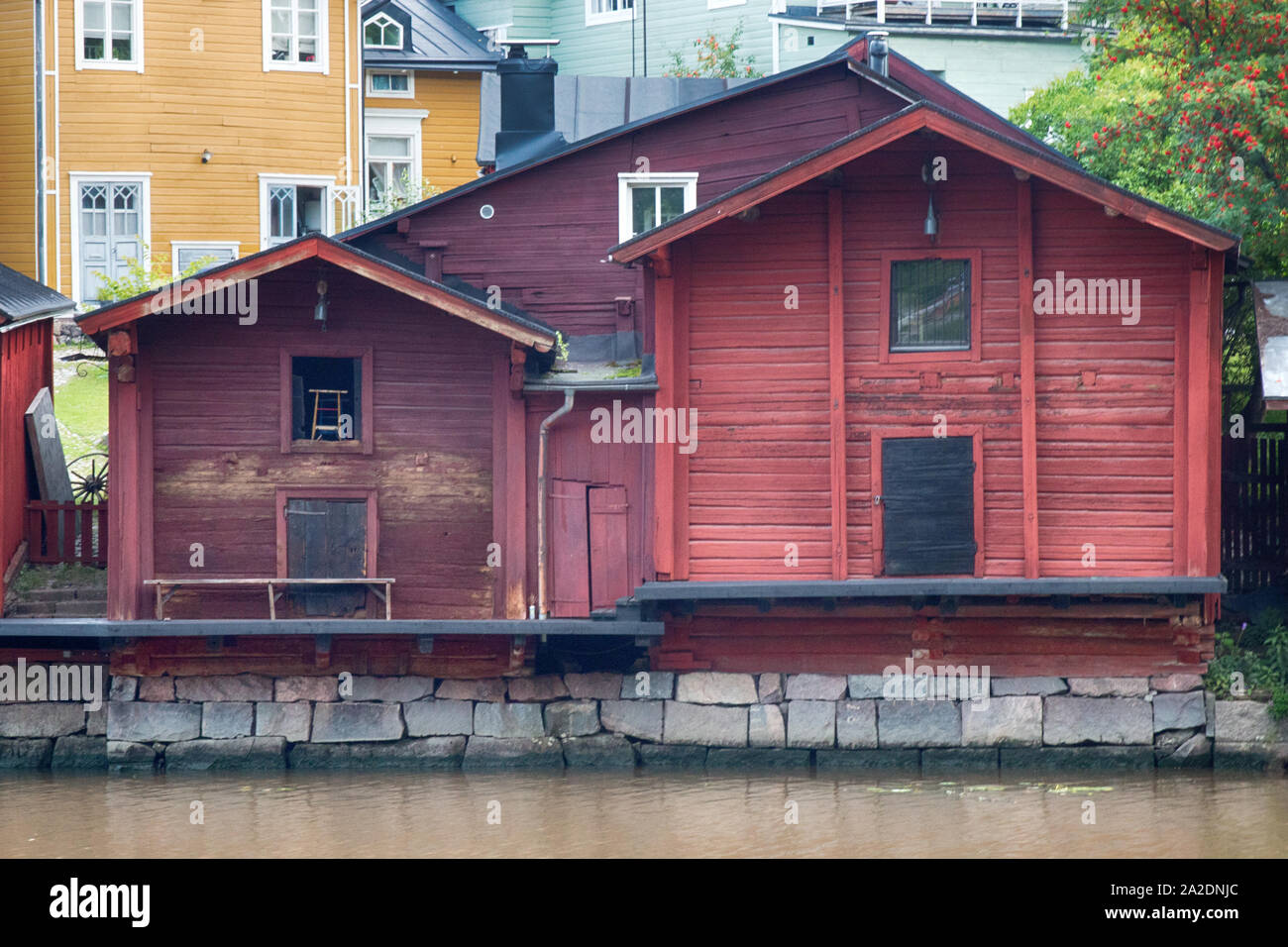 Porvoo river and it's scenic row of old rust red warehouses Stock Photo ...