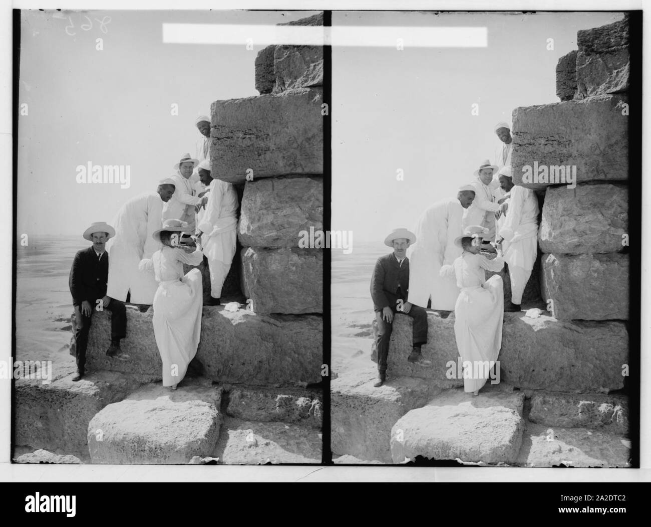 Egyptian views; The pyramids of Gizeh. Tourists ascending the Great ...