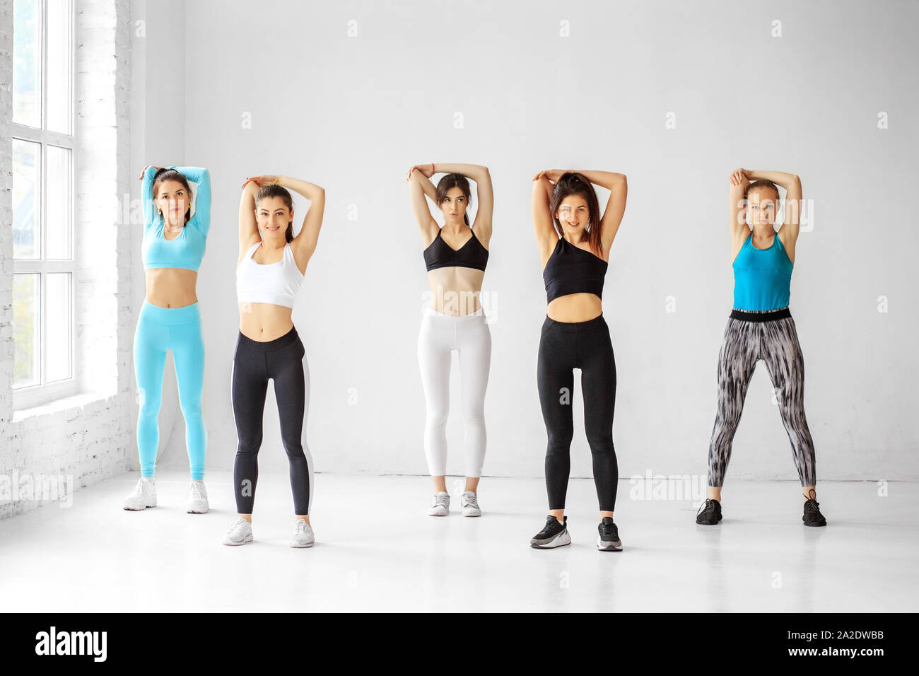 Stretching in the dance class. The concept of sports, a healthy ...
