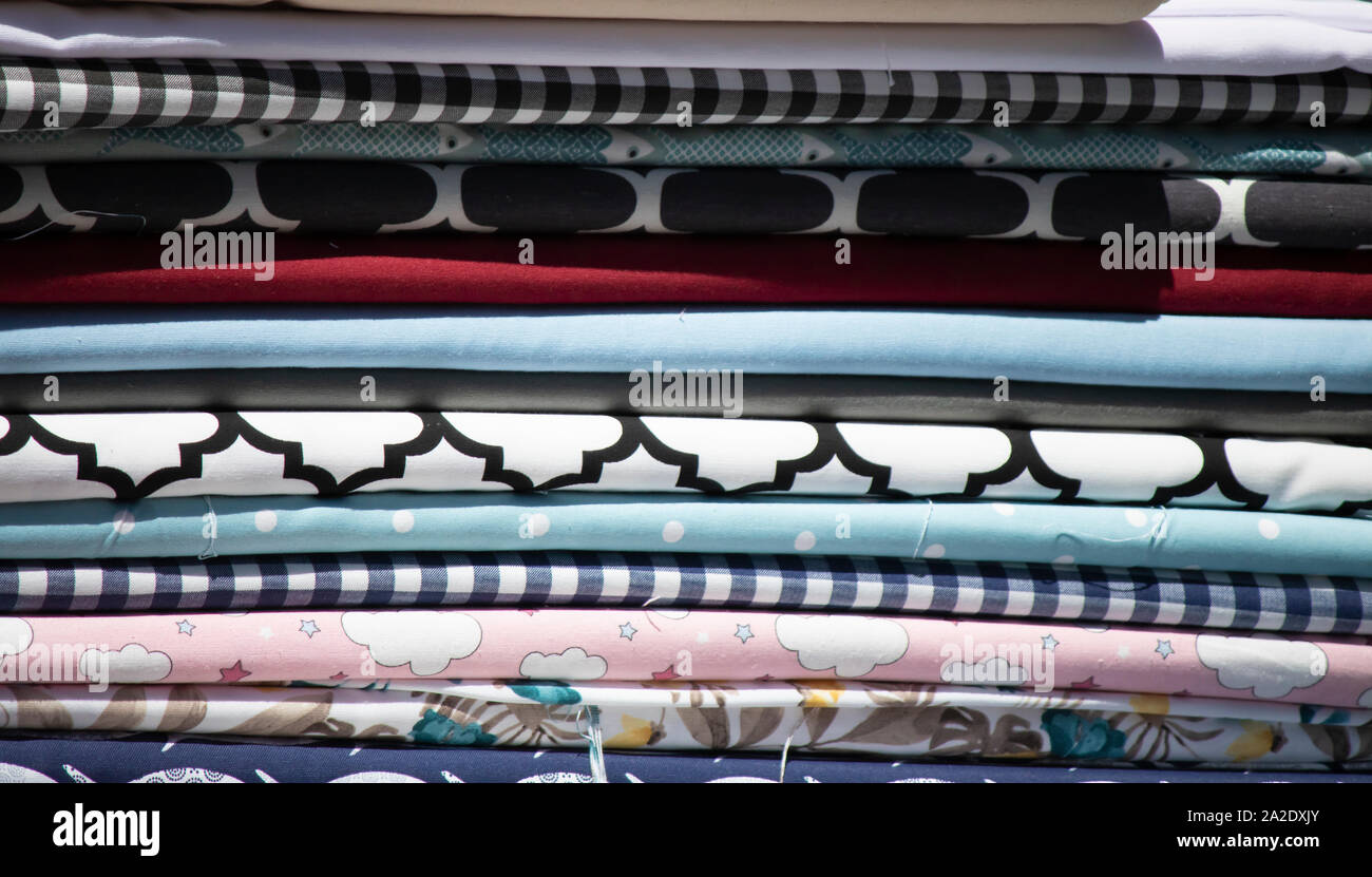 Fabrics in different patterns lined up in a row Stock Photo - Alamy