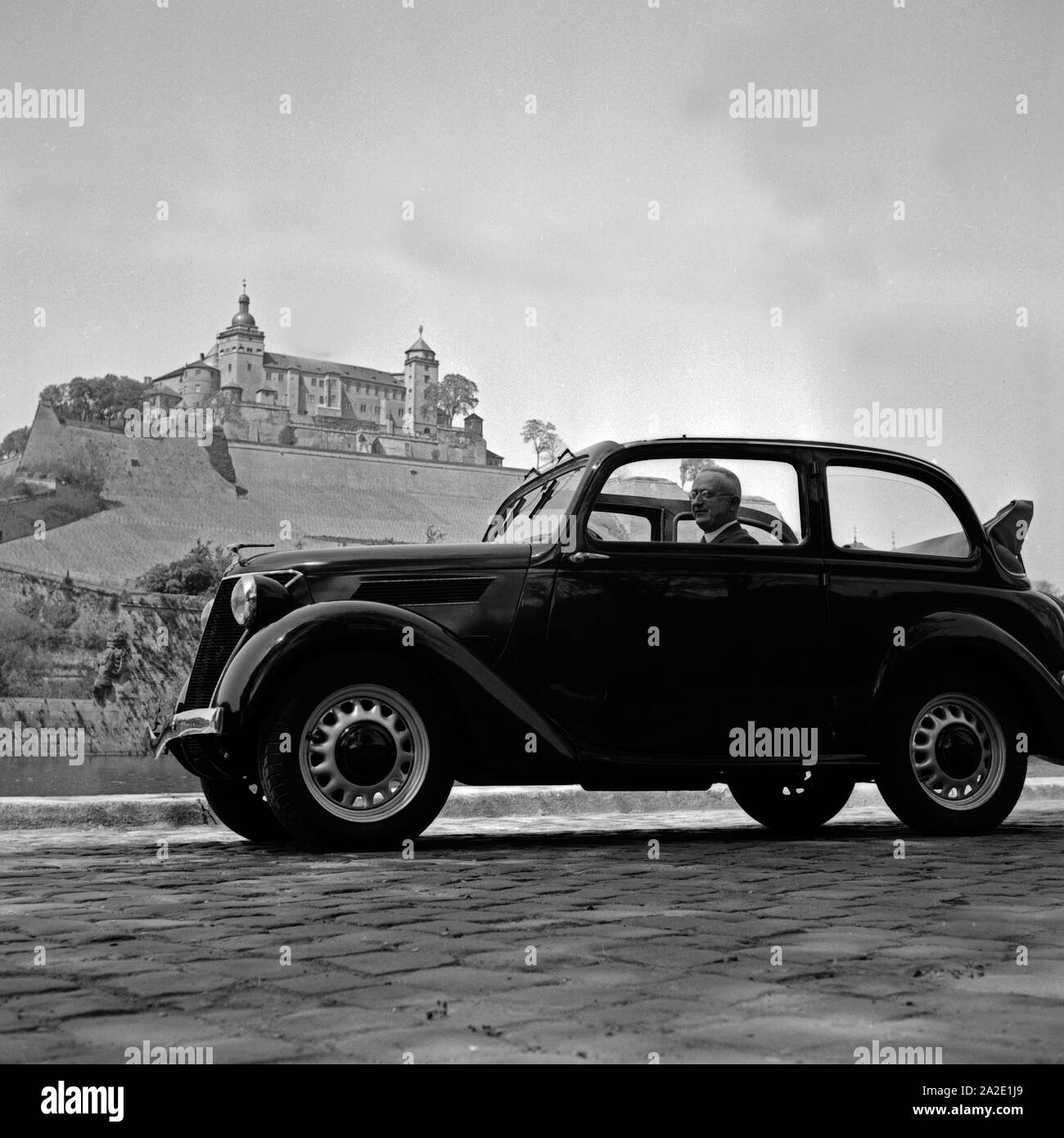 Man in front car Black and White Stock Photos & Images - Alamy