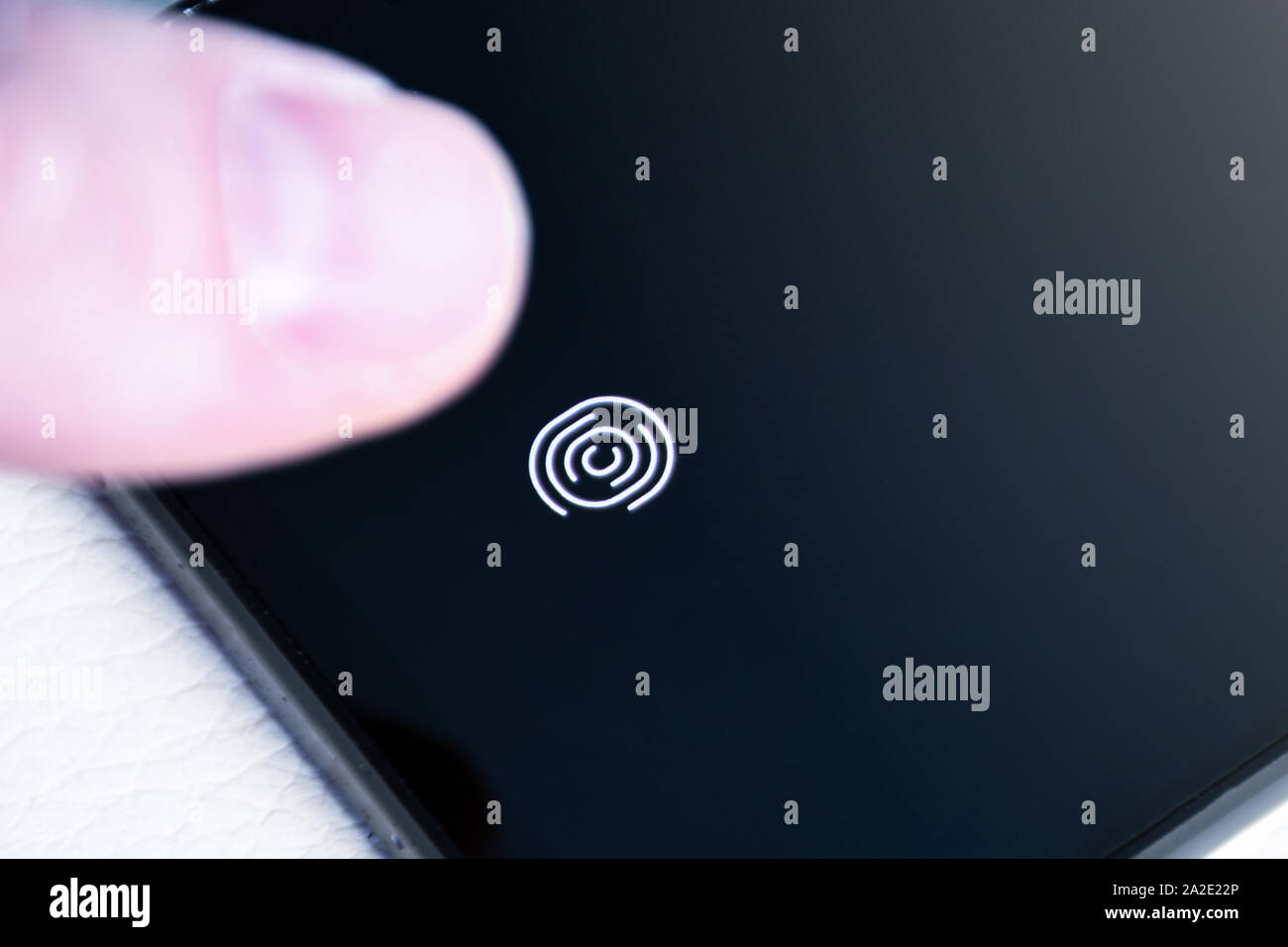 Unlocking the phone with the finger on a digital fingerprint scanner ...