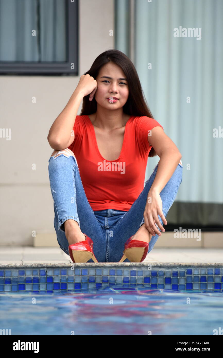 A Beautiful Diverse Woman Thinking Sitting Stock Photo - Alamy