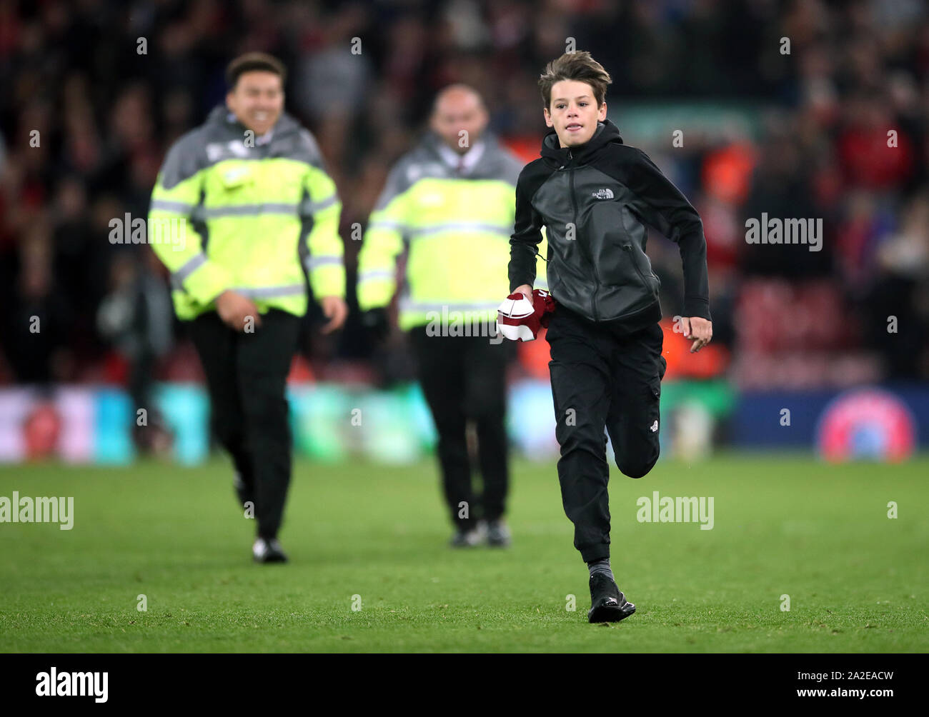 A young pitch invader attempts hi-res stock photography and images - Alamy
