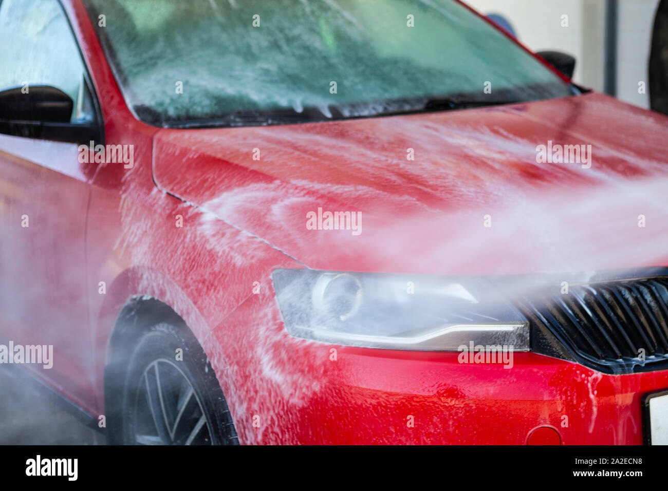 Car washing. Cleaning car using high pressure water Stock Photo - Alamy