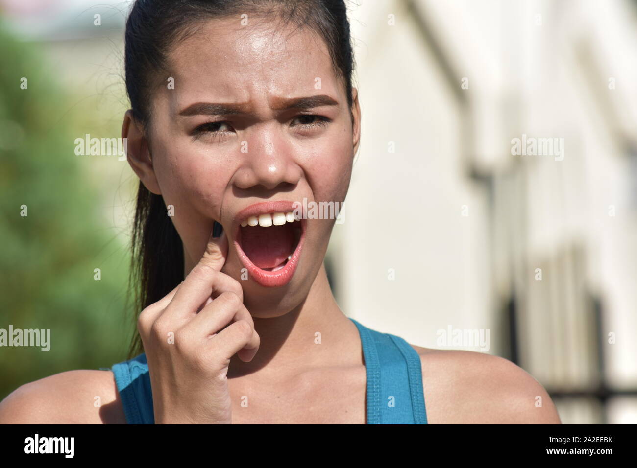A Diverse Female With Toothache Stock Photo - Alamy
