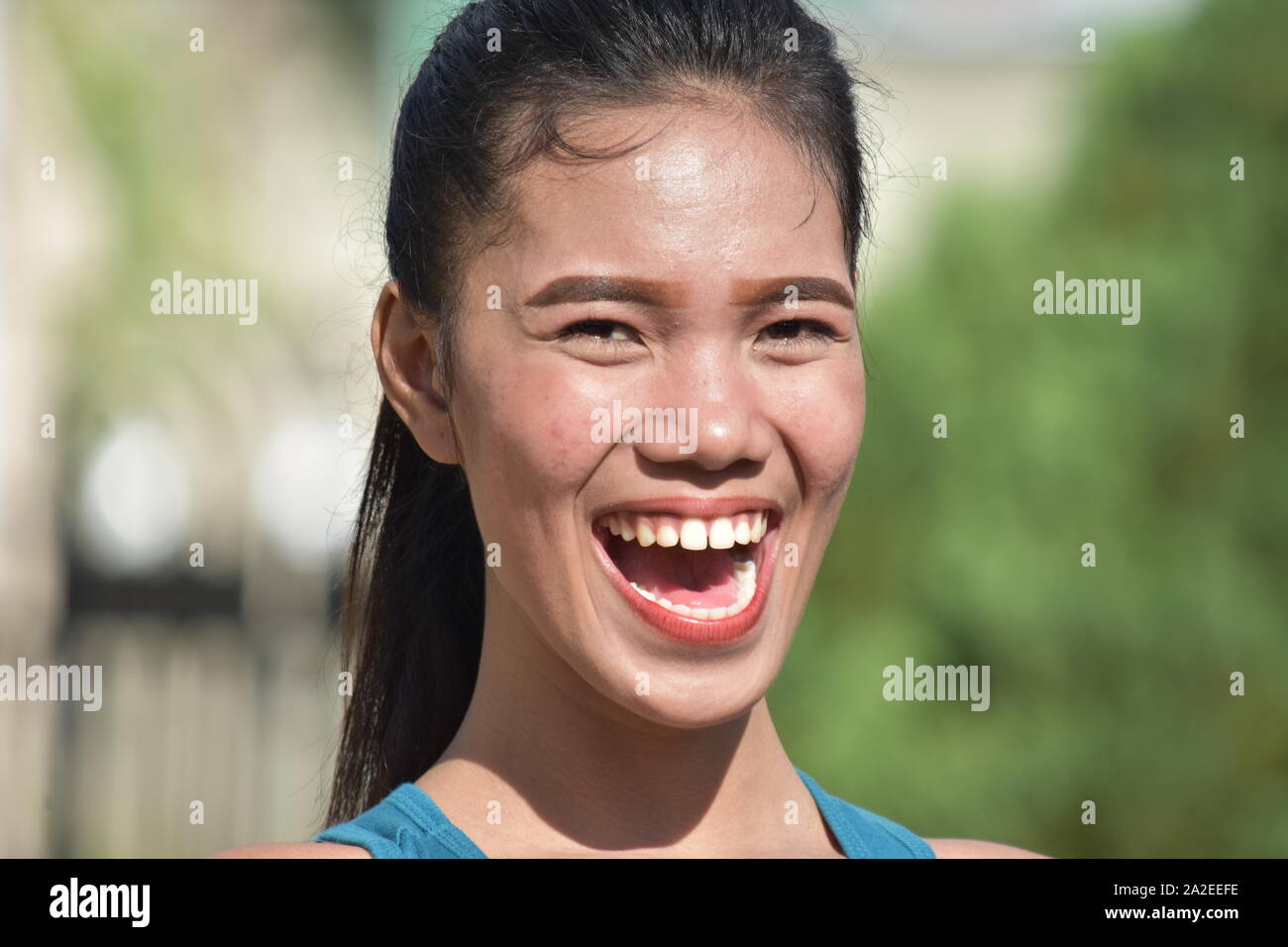 Attractive young asian woman laughs hi-res stock photography and images - Alamy