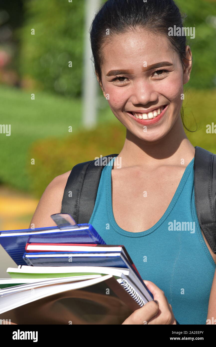 Smiling Pretty School Girl With Notebooks Stock Photo - Alamy