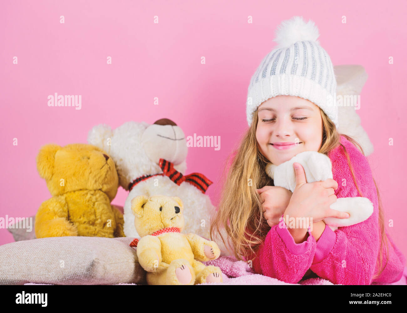 Child small girl playful hold teddy bear plush toy. Kid little girl ...