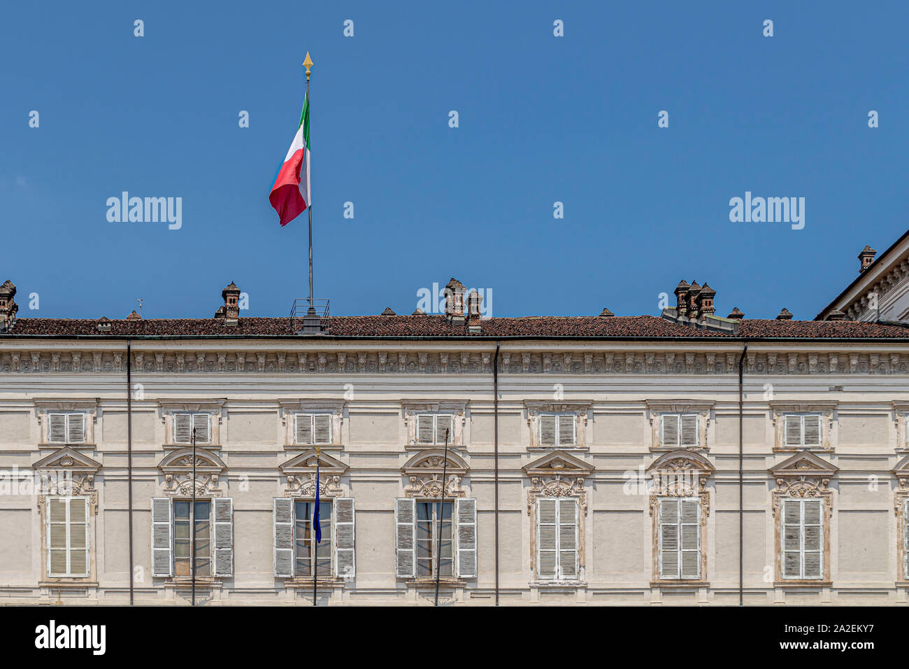 Close up of the roof and windows and Italian flag of The Royal Palace ...