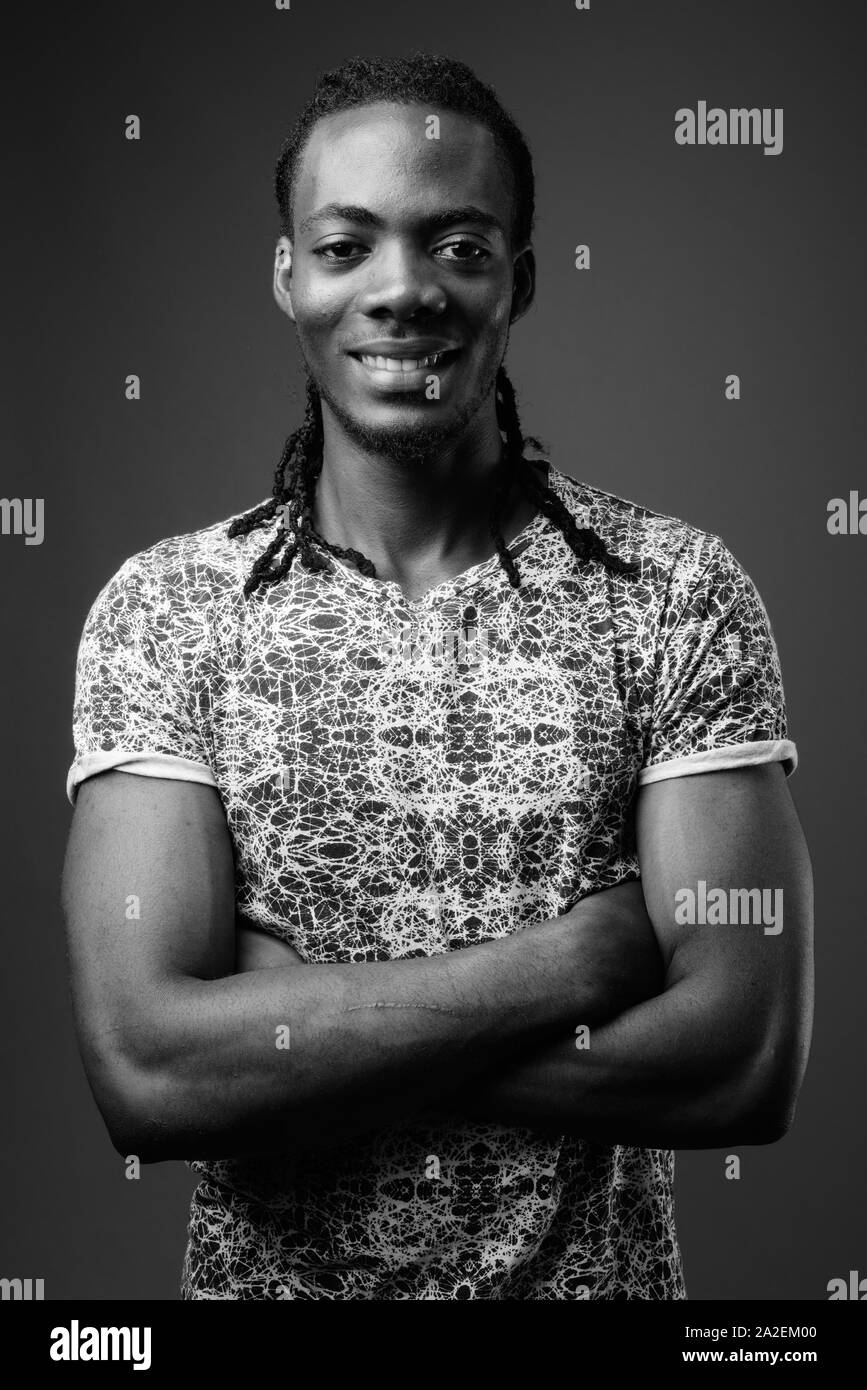 Portrait handsome african guy arms Black and White Stock Photos ...