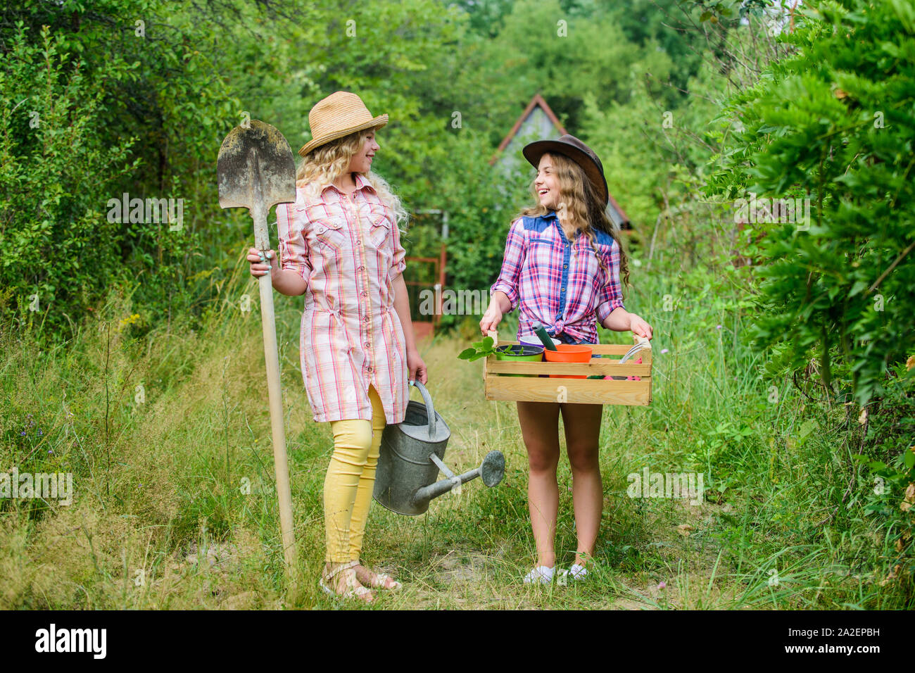 Beautiful female florists. earth day. summer family farm. small girls ...