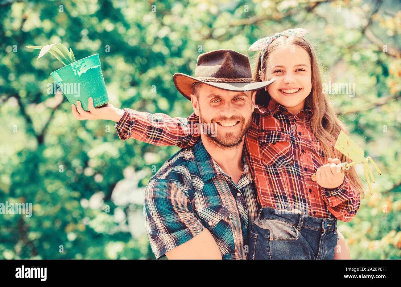 father and daughter. family farm. agriculture. little girl and happy ...