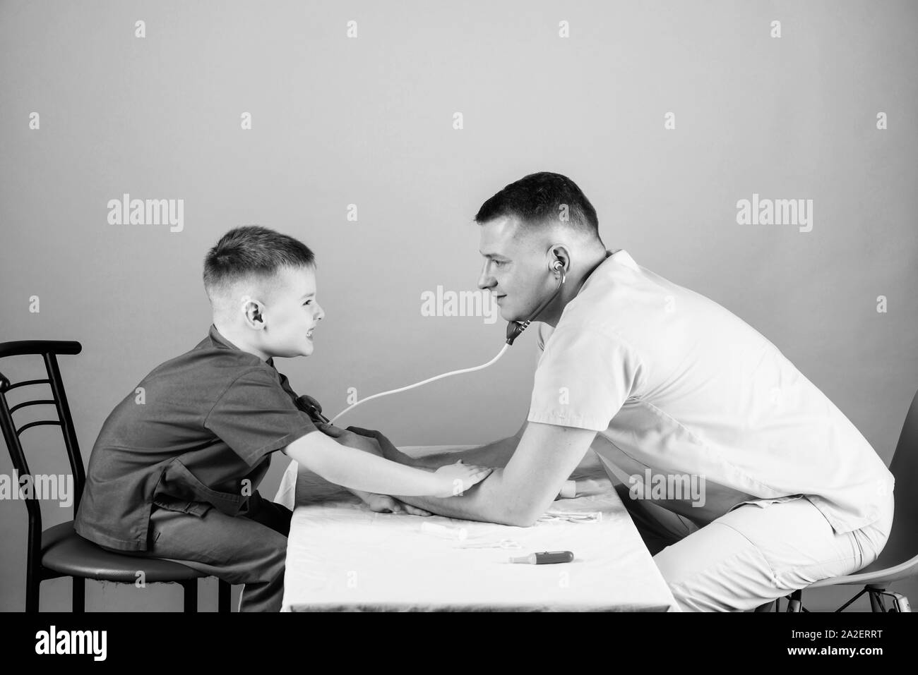 professional talk. medicine and health. small boy with dad play. Future ...