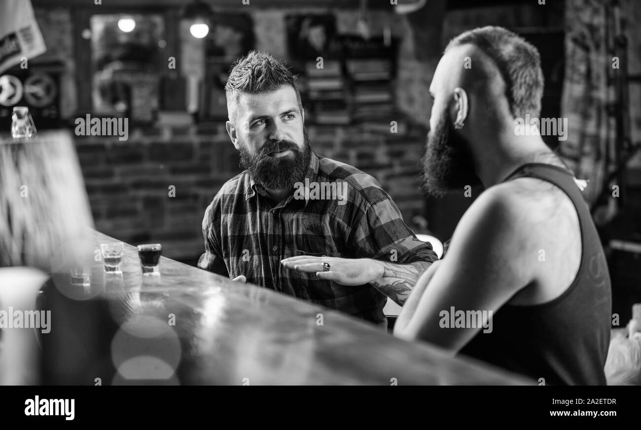 Strong alcohol drinks. Friday relaxation in bar. Friends relaxing in ...