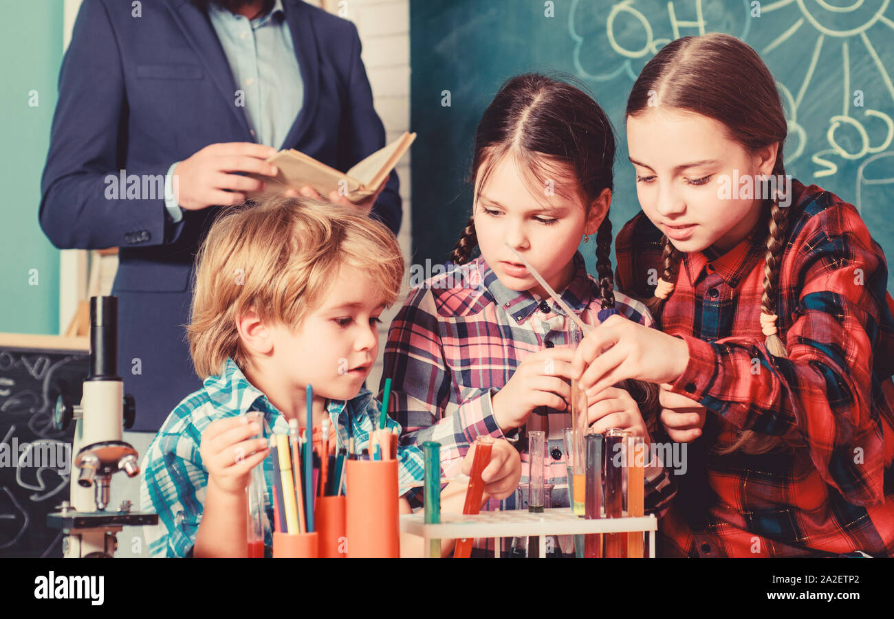 Inspired to work hard. happy children teacher. doing experiments with ...