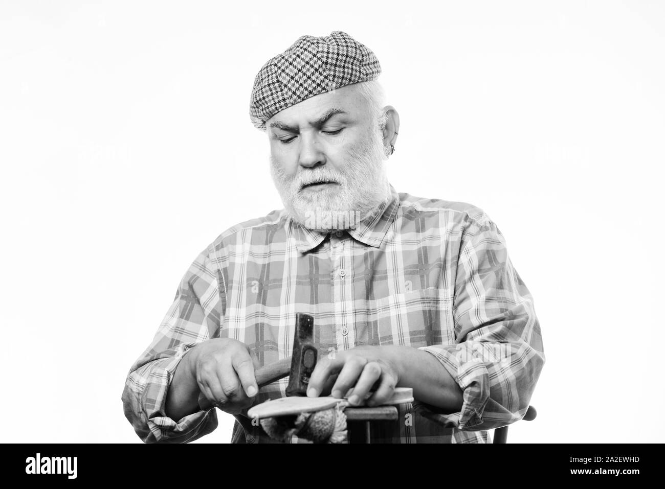 retro man repair shoes with hammer. Cobbler workmanship. mature ...