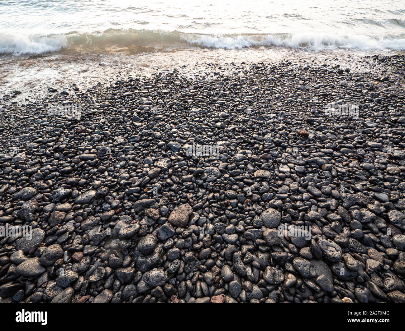 A close up view of a thousands of rocks on a beach in Maui Stock Photo ...