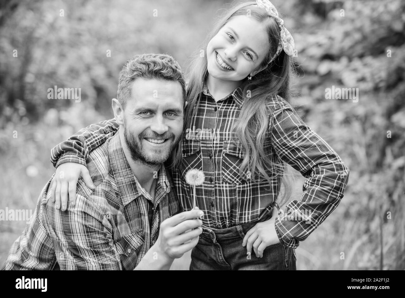 daughter and father with dandelion. spring village country. ecology ...