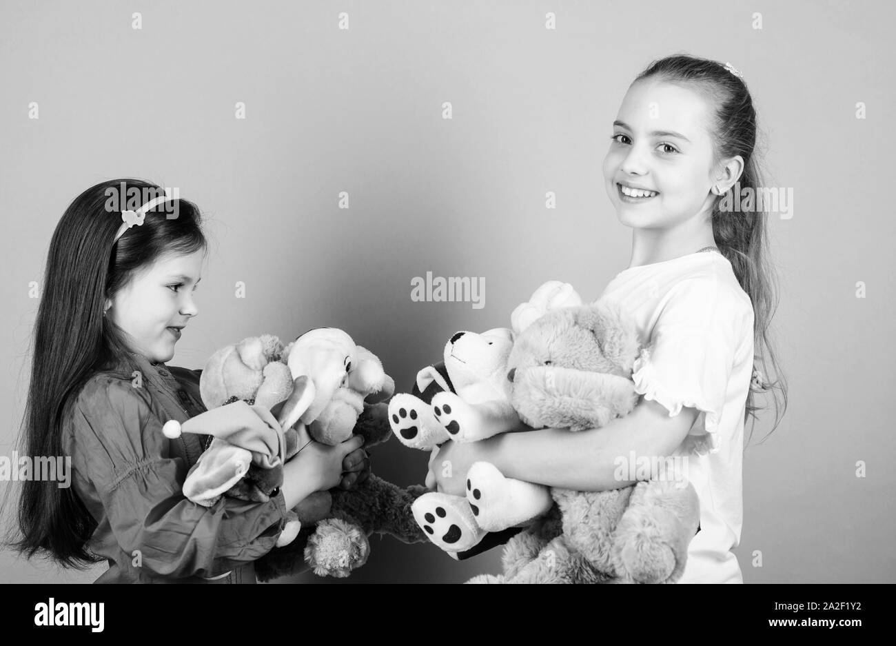 Family is the most important thing. small girls with soft bear toys ...