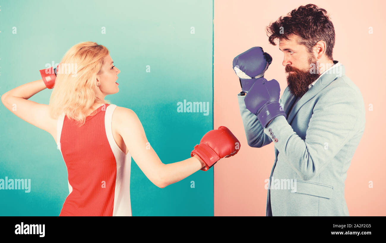 Gender equality. Man formal suit and athletic woman boxing fight ...