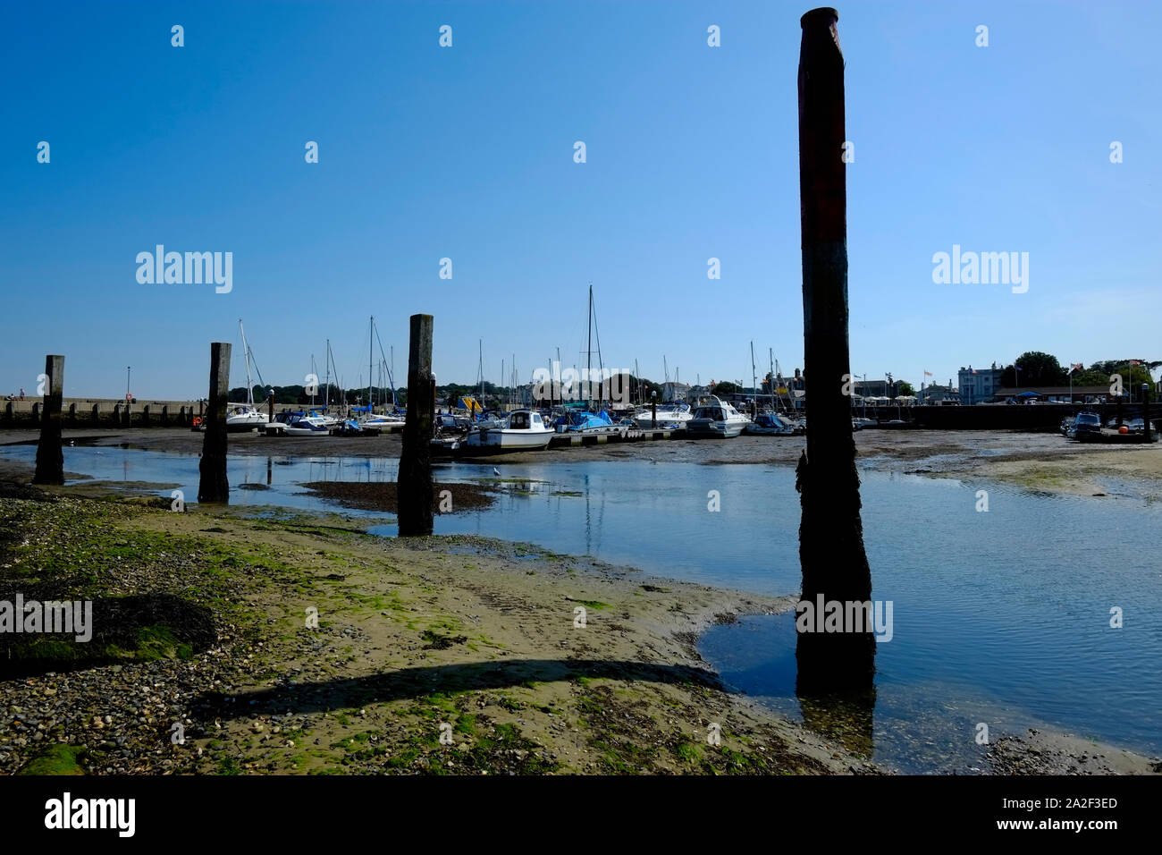 Ryde Harbour on the Isle of Wight at low tide showing yachts and motor ...