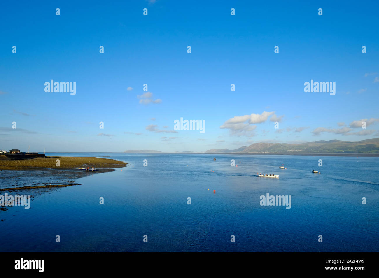 View from Beaumaris Pier Anglesea of the Menai Straight at low tide on ...