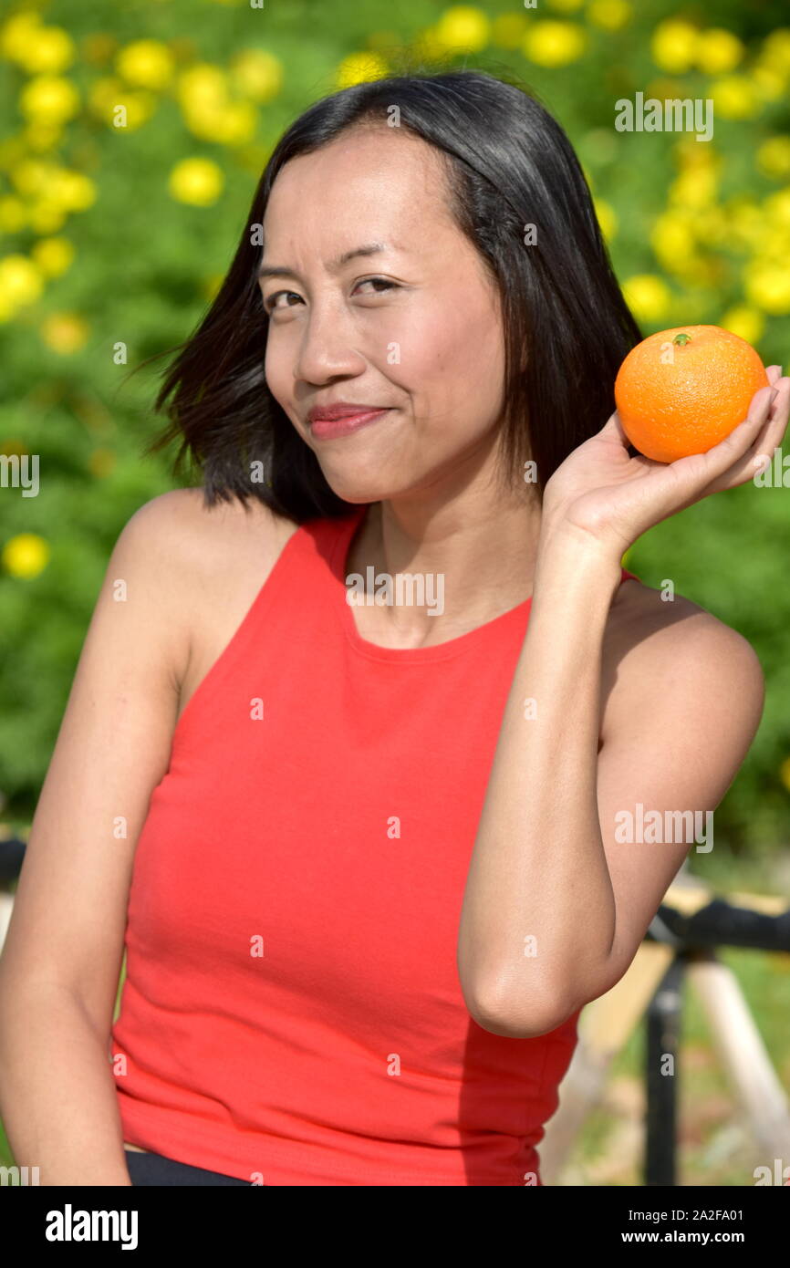 Beautiful woman looking fruit hi-res stock photography and images - Alamy
