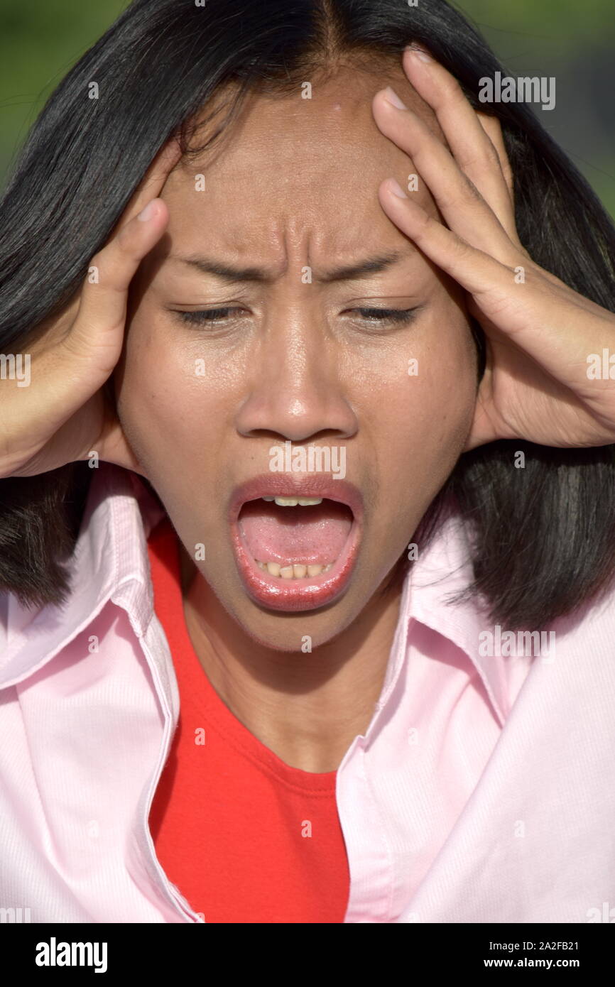 A Diverse Adult Female Under Stress Stock Photo - Alamy