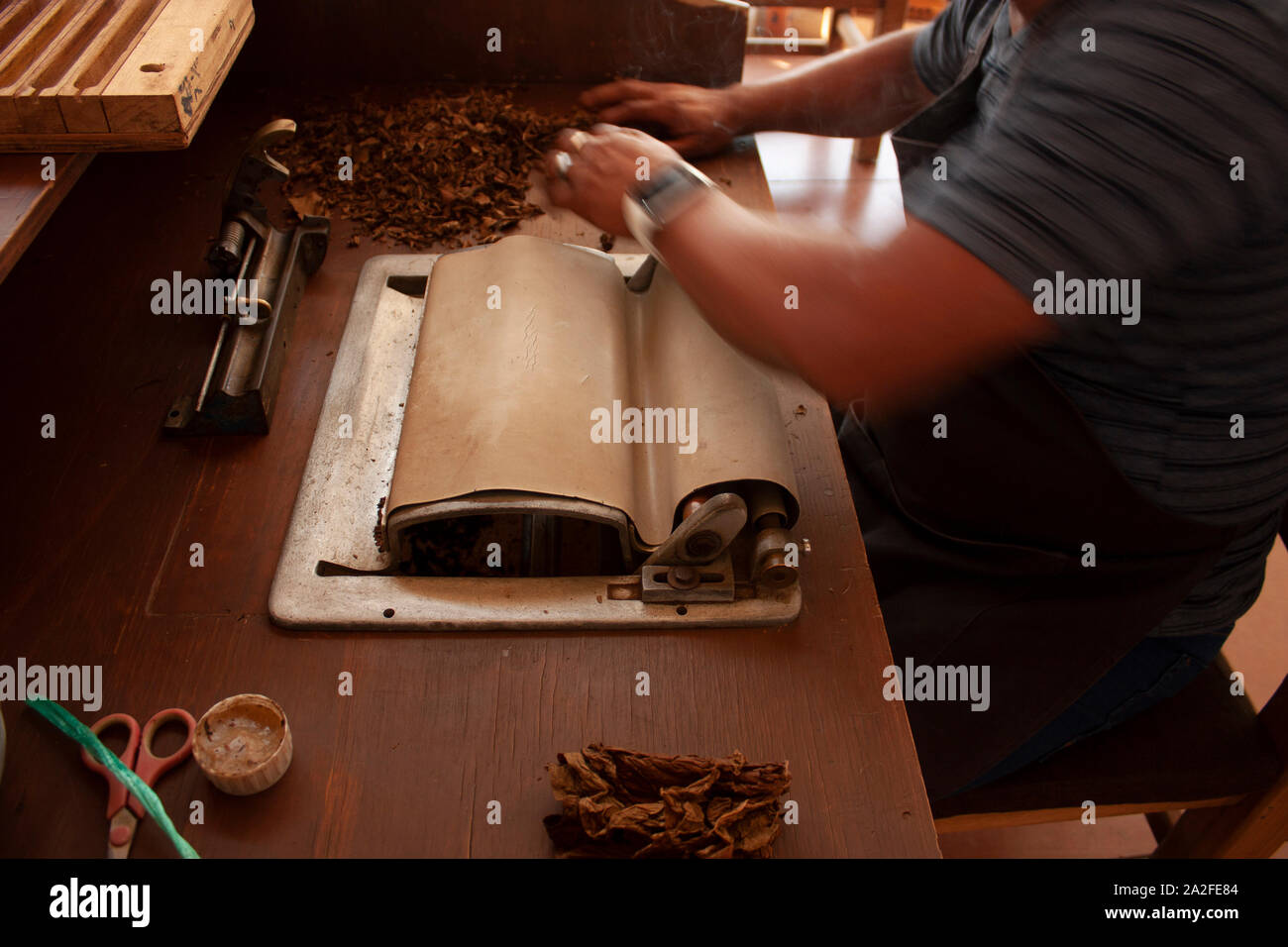 Rolling machine waiting for the man's hands to accommodate pieces of ...