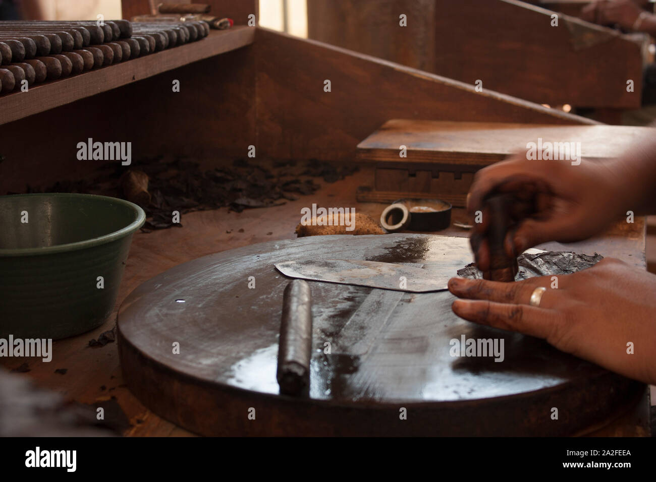 handmade tobacco industry in Mexico city hands rolling a cigar, scene ...