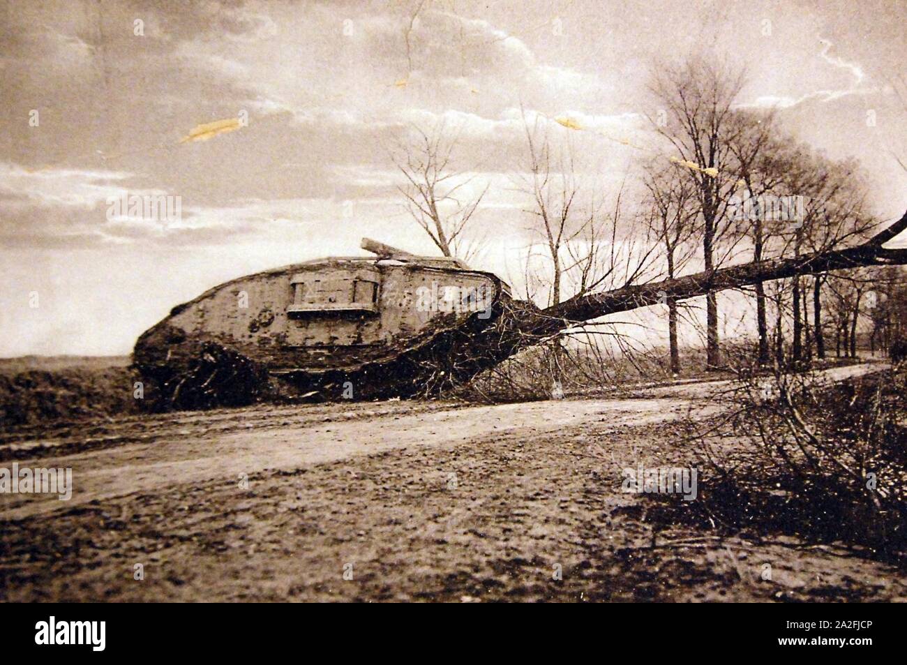 English tank overturning and crashing into a tree during WWI ...