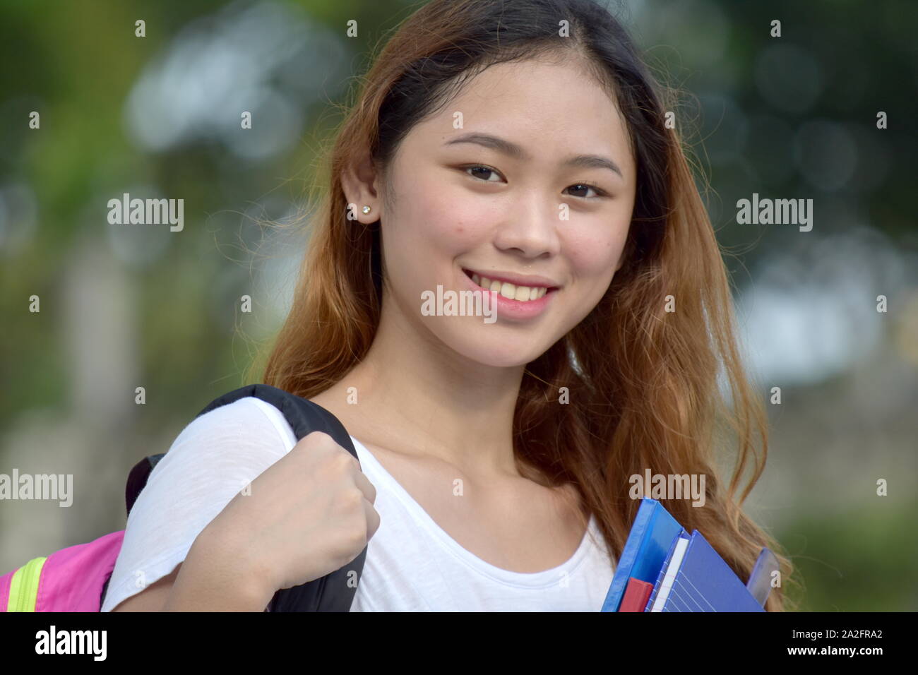 Happy smiling pretty student hi-res stock photography and images - Alamy