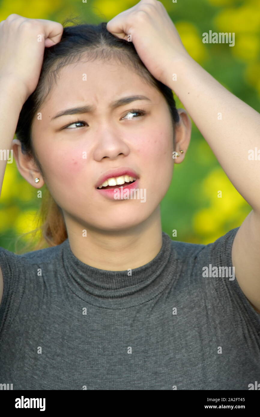 A Stressed Youthful Asian Woman Stock Photo - Alamy