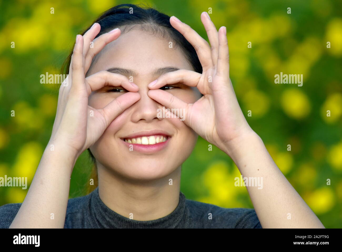 A Youthful Asian Woman Looking Stock Photo - Alamy