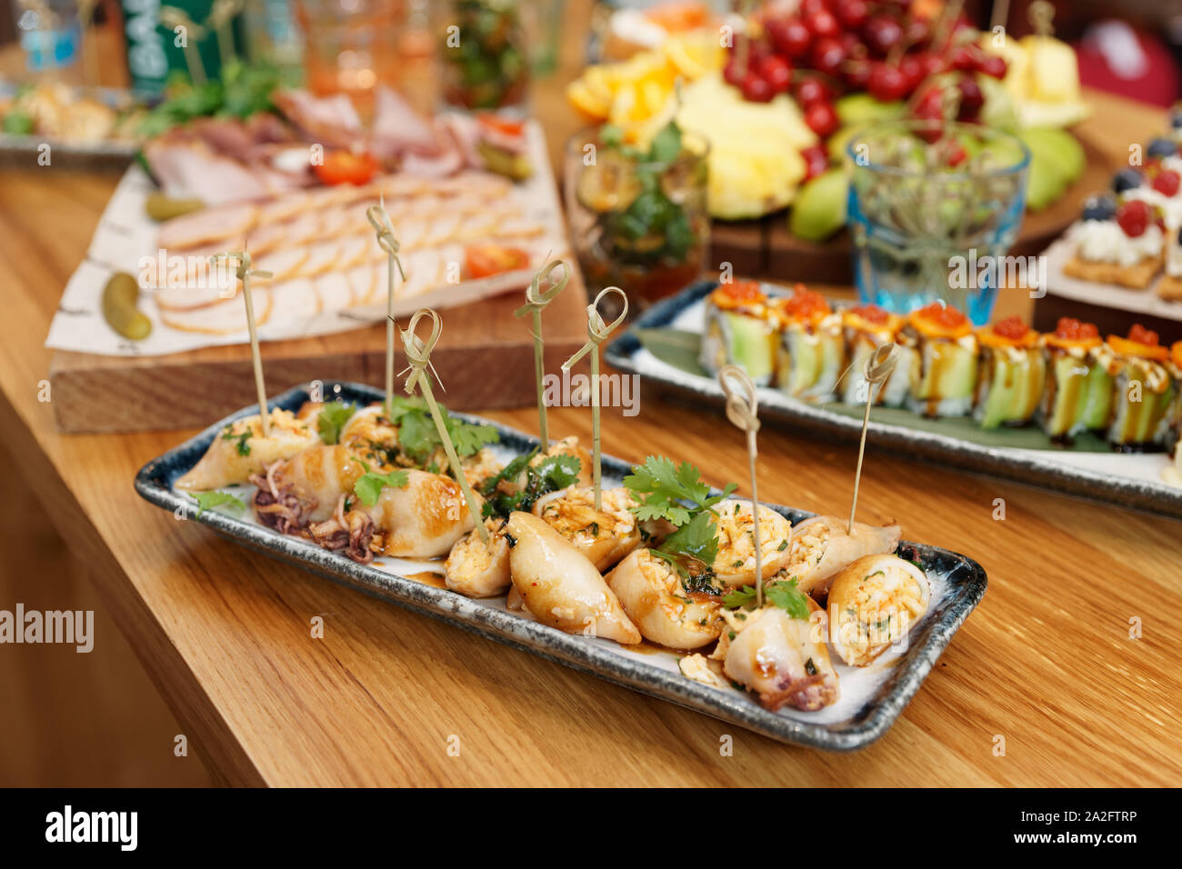 Stuffed squid cooked in Asian style with cilantro, and another food ...